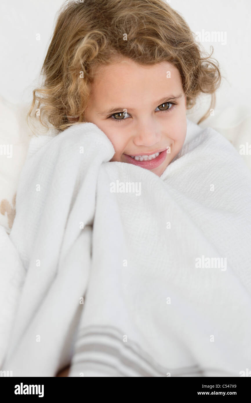 Cute little girl wrapped in a white towel Stock Photo - Alamy