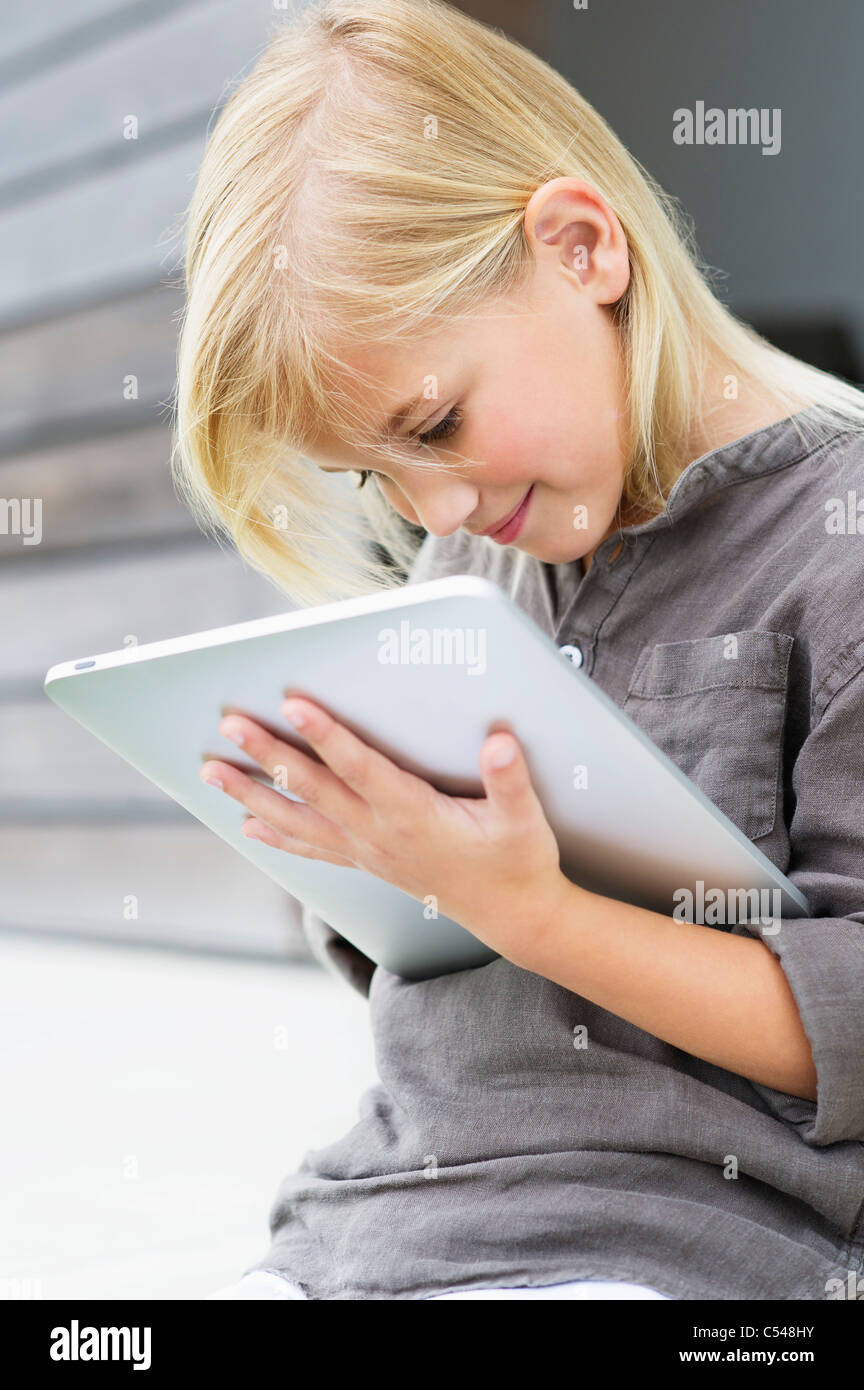 Girl using a digital tablet Stock Photo - Alamy