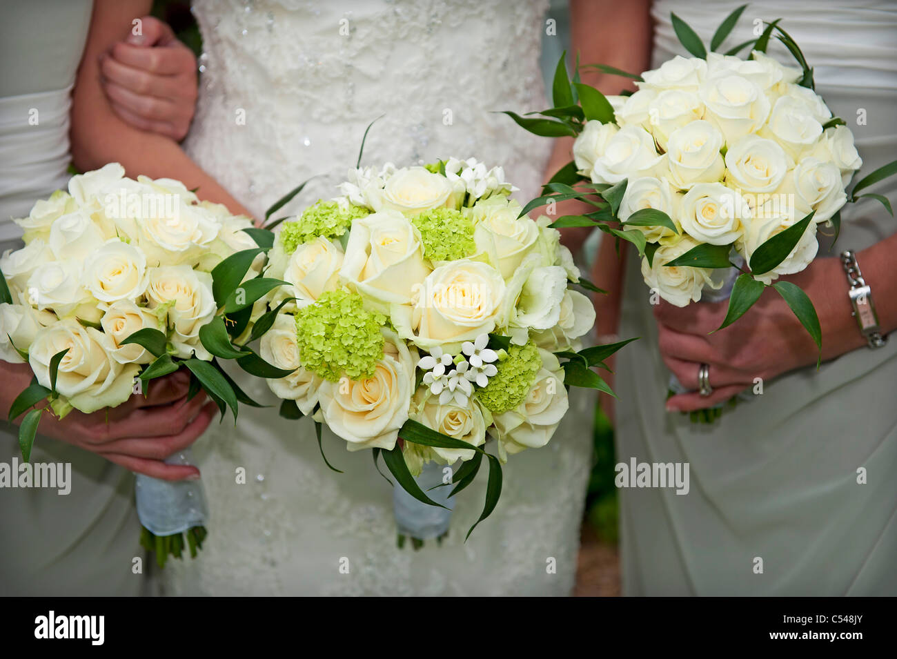 three wedding bouquets of white roses Stock Photo - Alamy