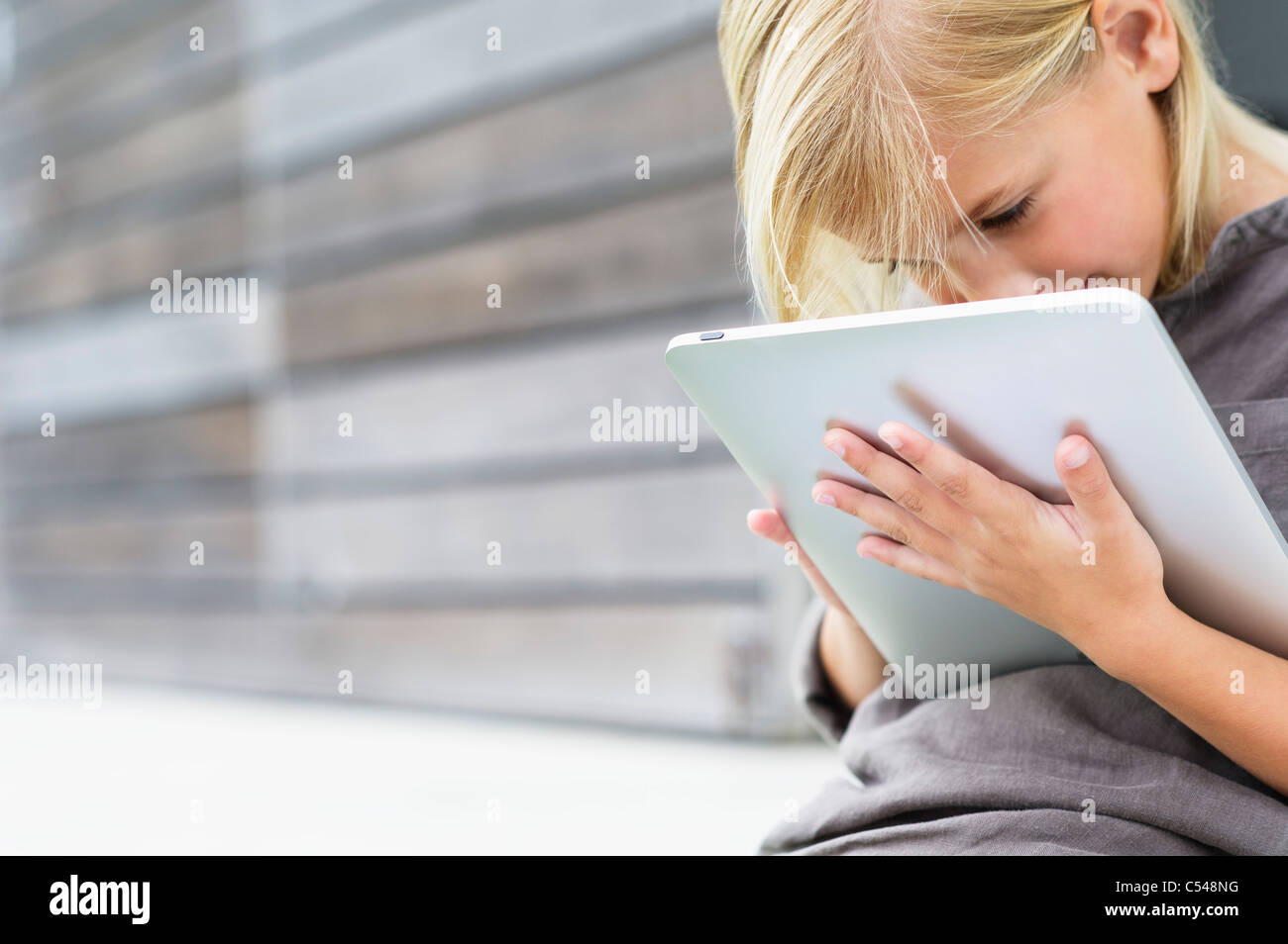 Girl using a digital tablet Stock Photo - Alamy