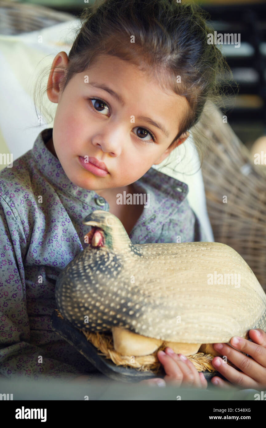Portrait of a little girl holding model of turkey Stock Photo - Alamy