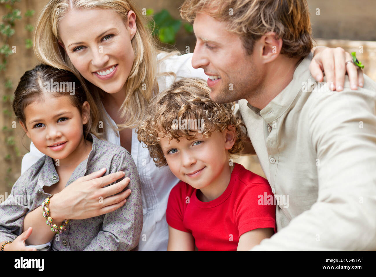 Portrait of a family with two children Stock Photo - Alamy