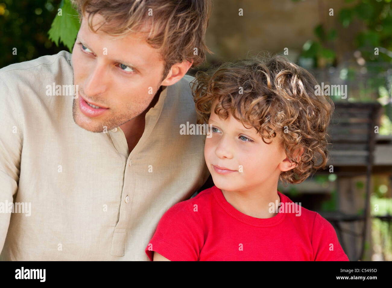 Father and son looking away Stock Photo - Alamy