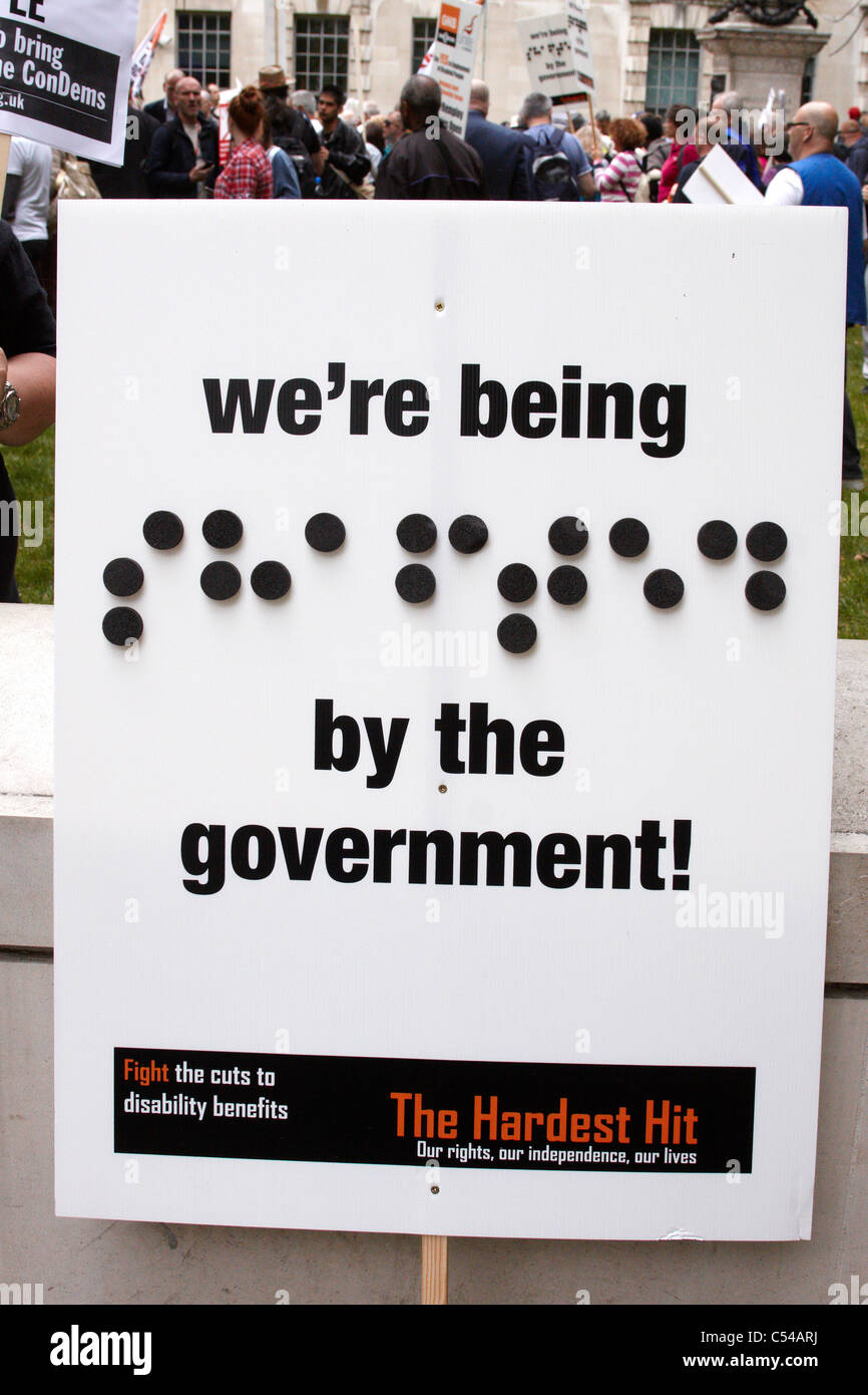 Thousands of disabled people march past Parliament to protest against ...