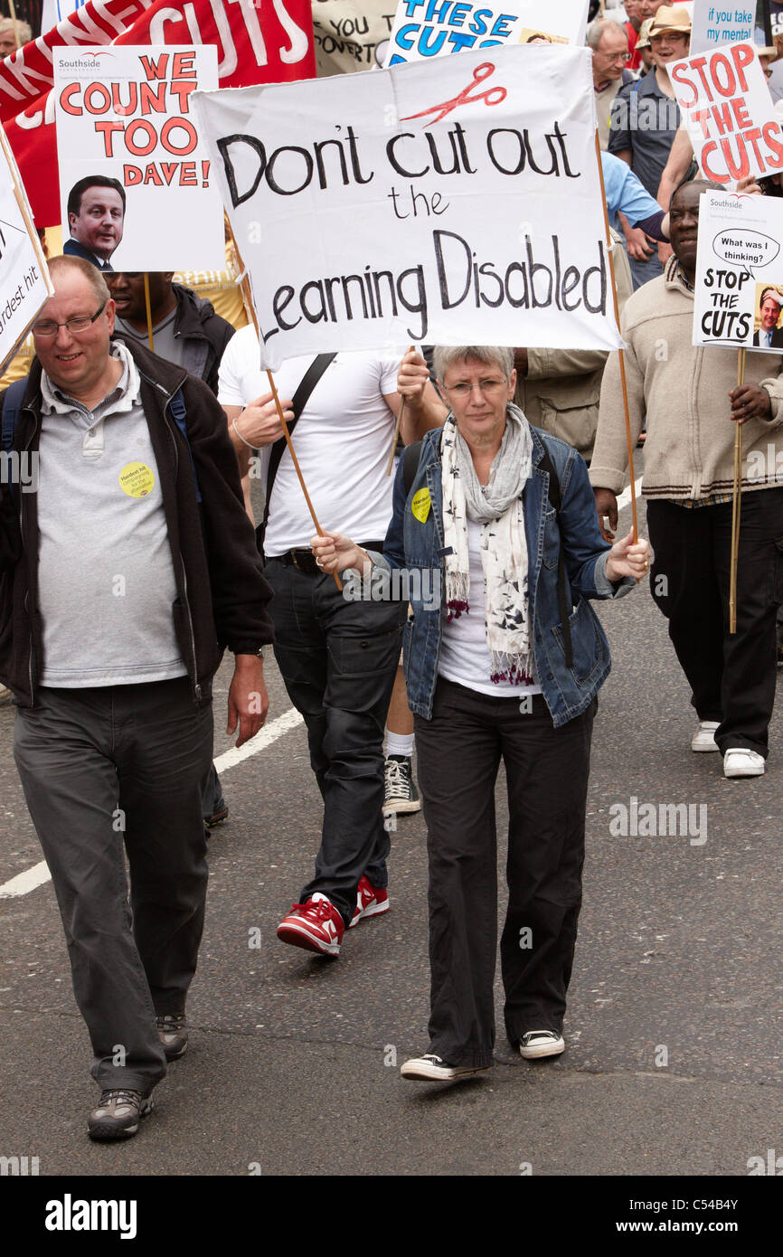 Thousands of disabled people march past Parliament to protest against ...