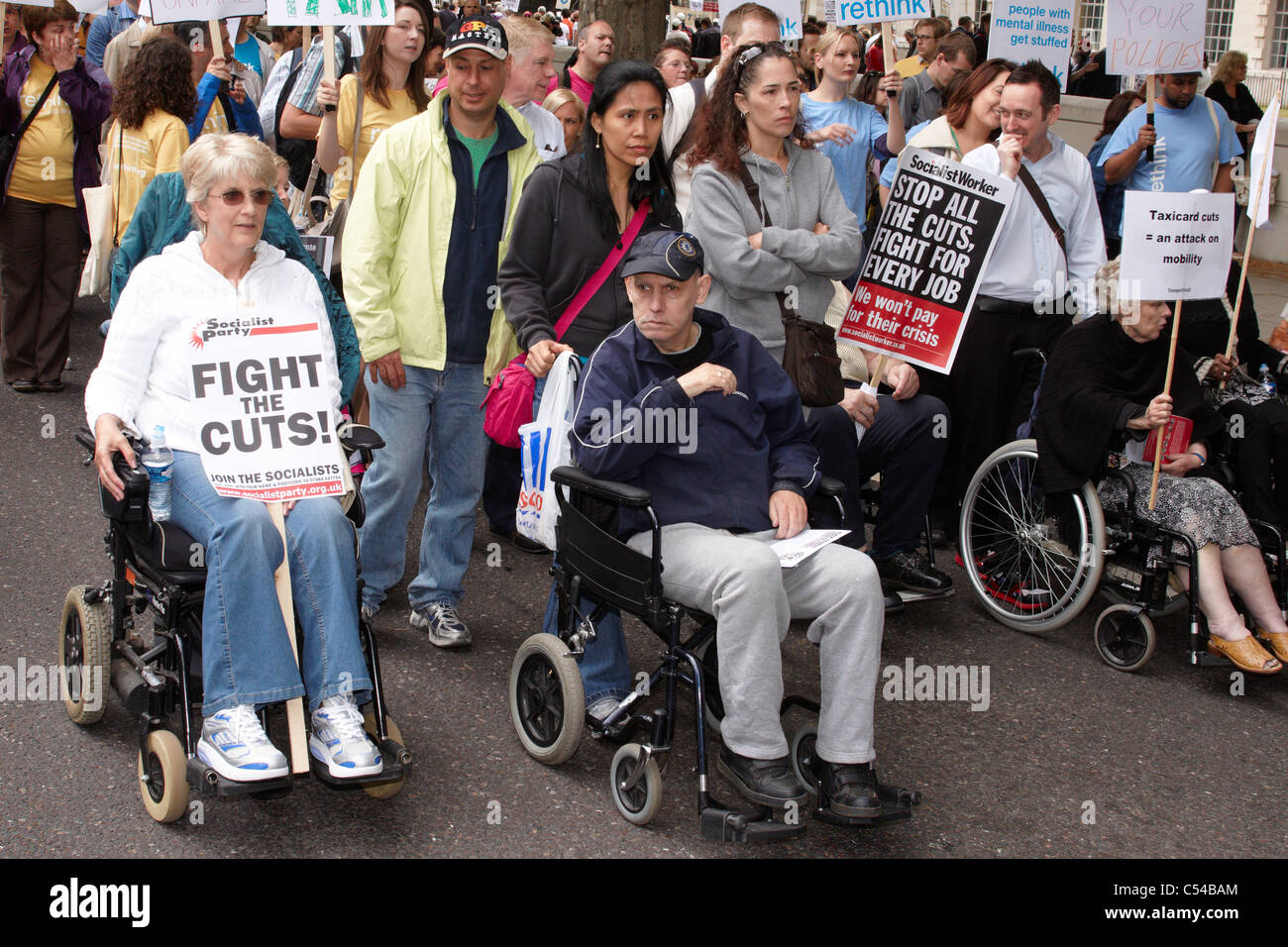 Thousands of disabled people march past Parliament to protest against ...
