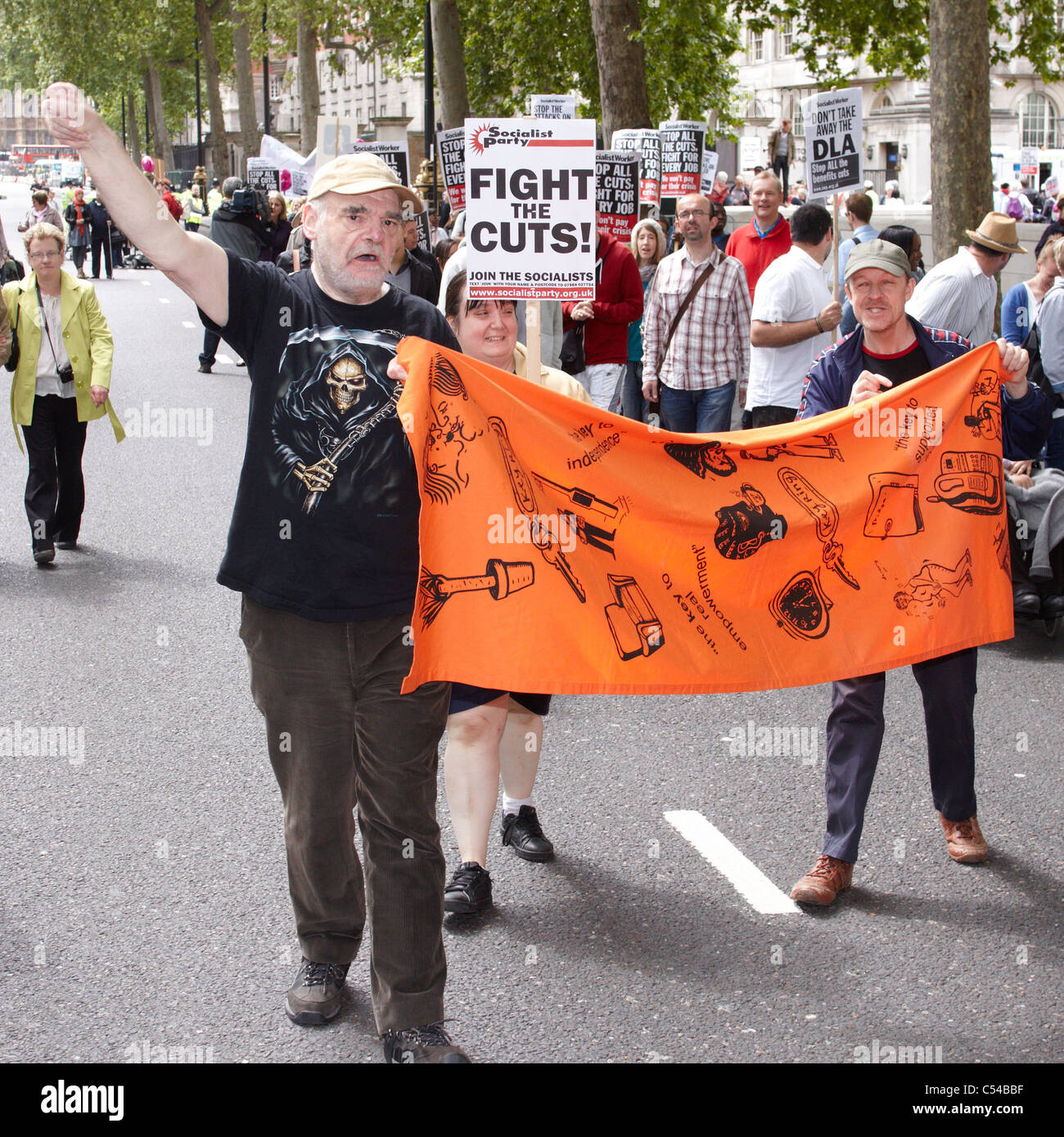 Thousands of disabled people march past Parliament to protest against ...