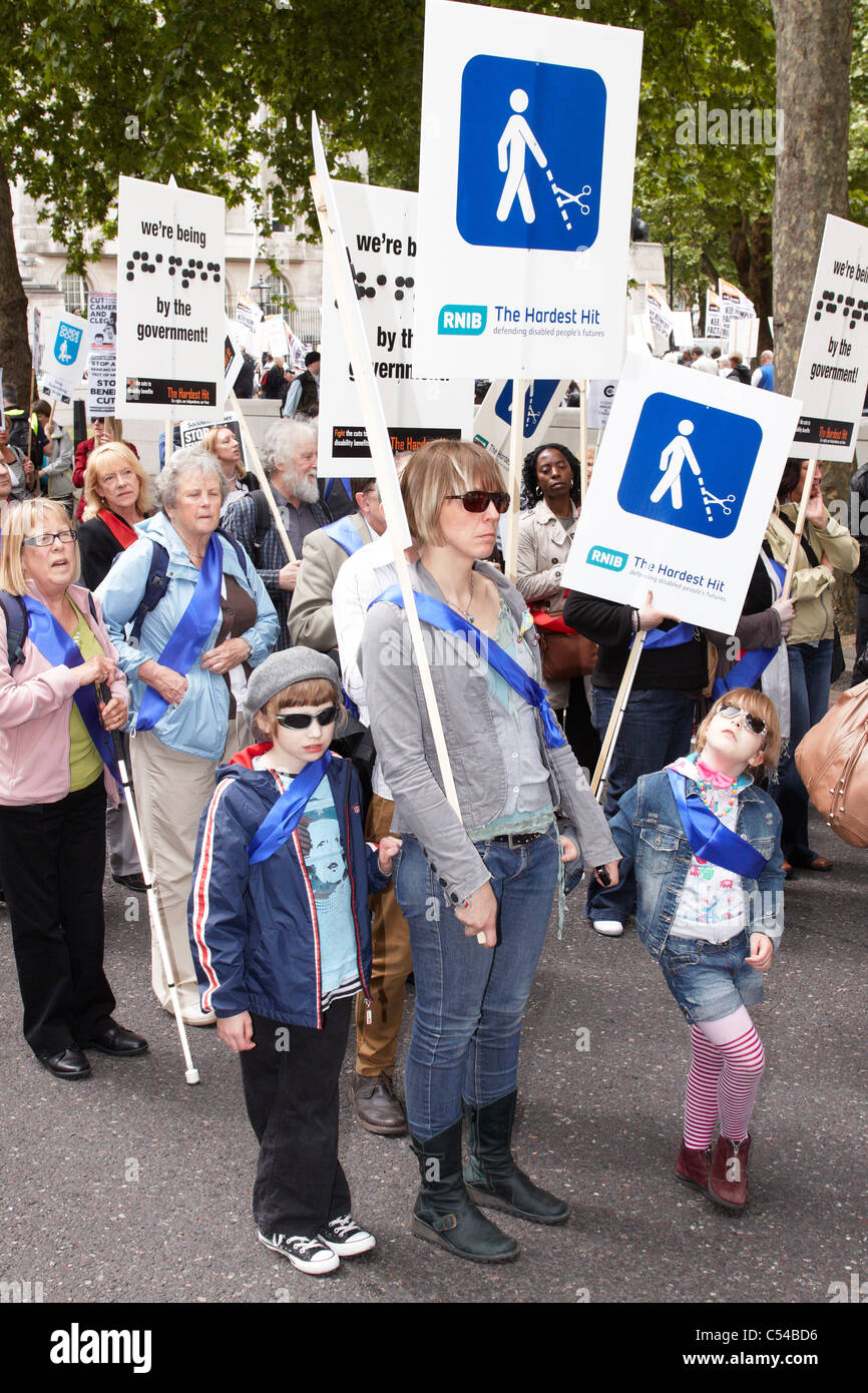 Thousands of disabled people march past Parliament to protest against ...