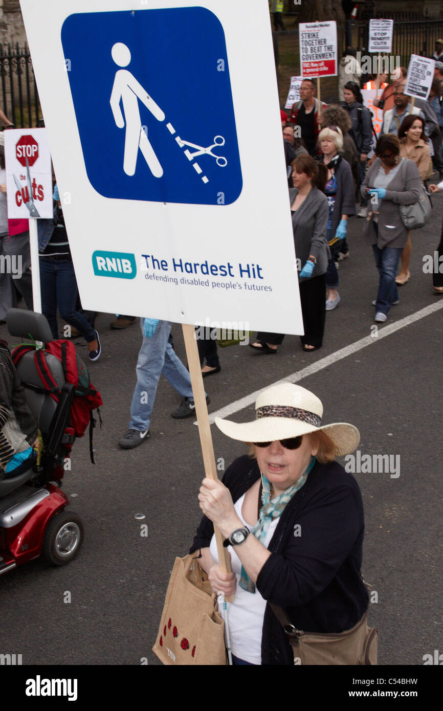 Thousands of disabled people march past Parliament to protest against ...