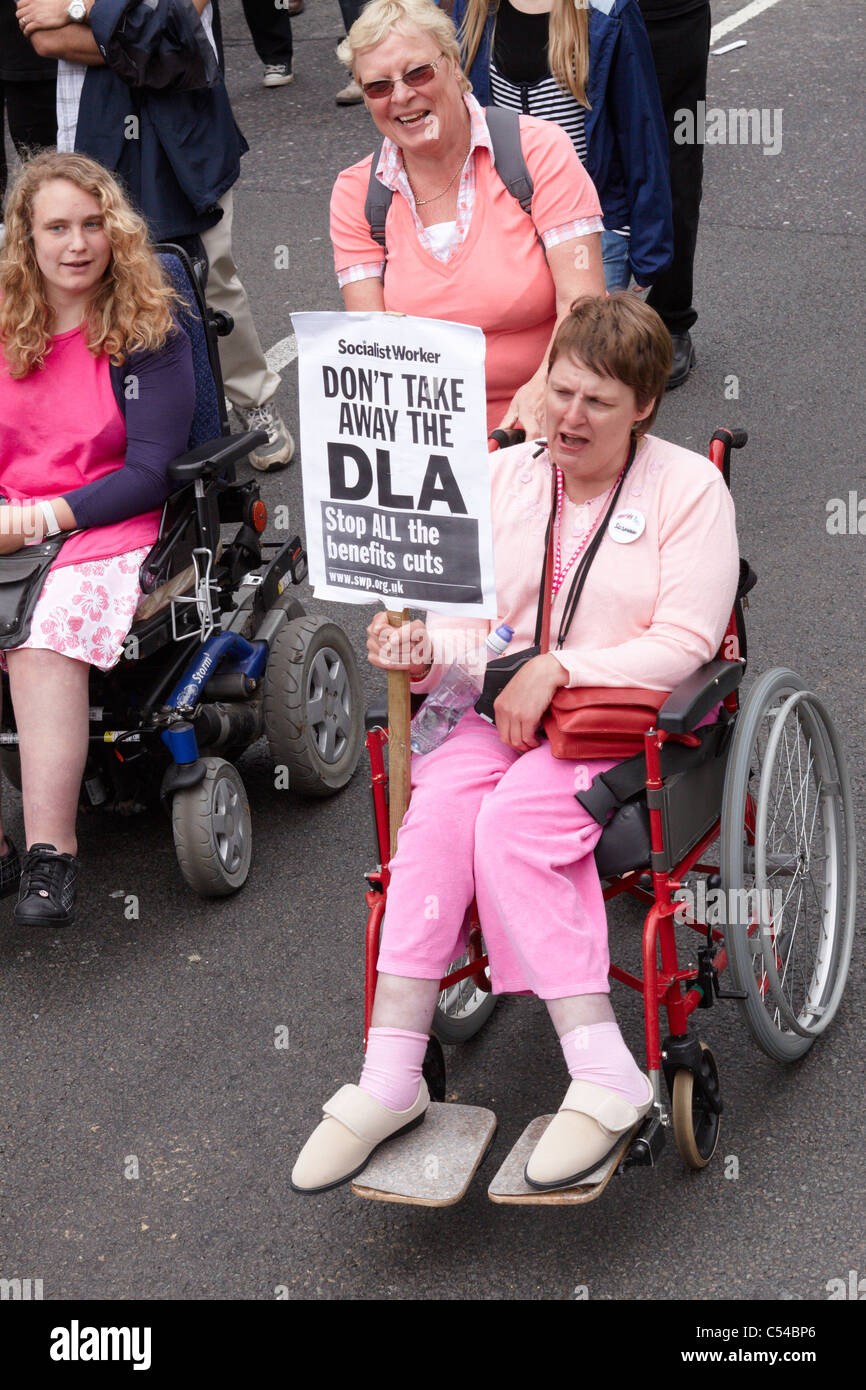 Thousands of disabled people march past Parliament to protest against ...