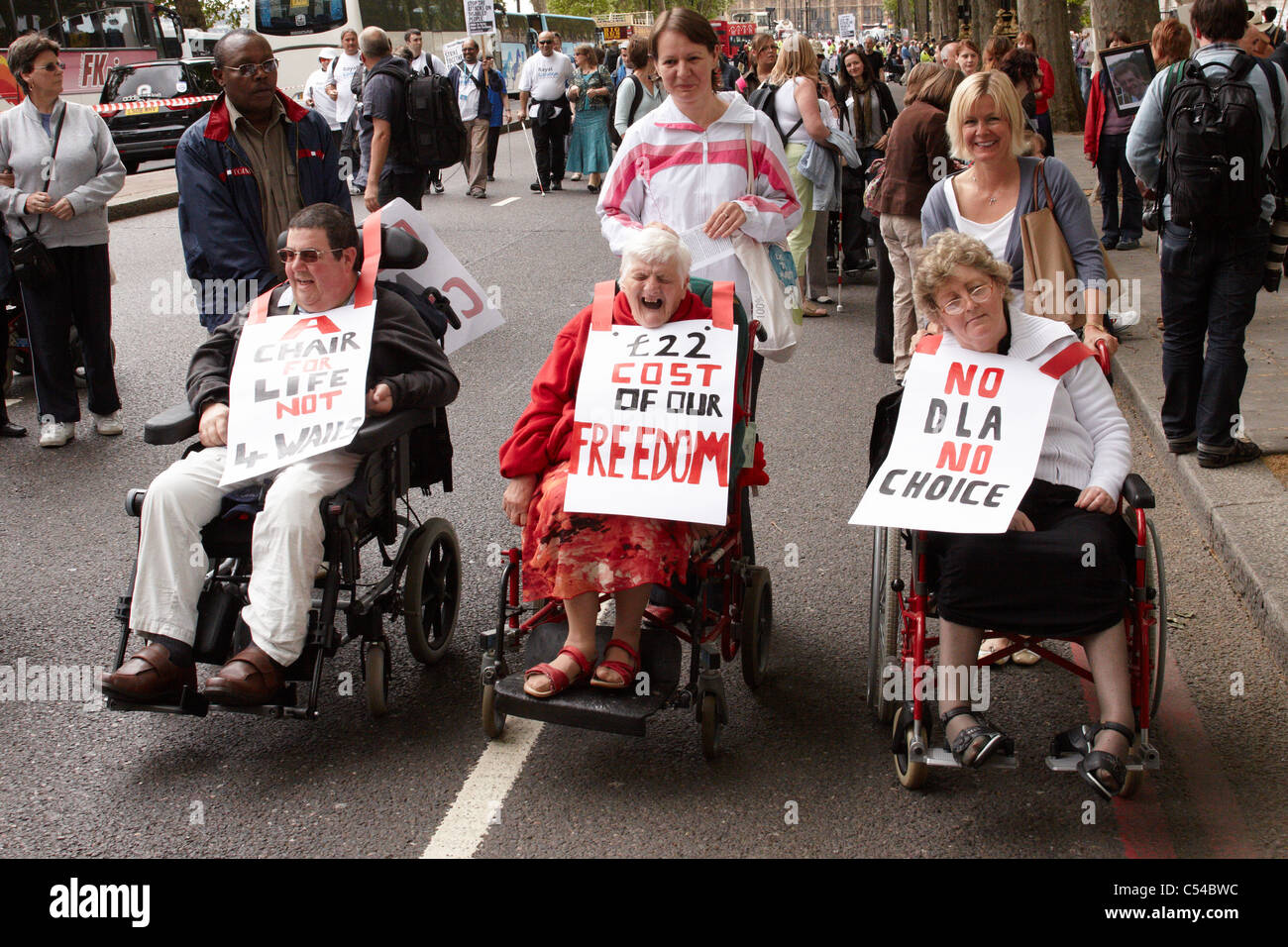 Thousands of disabled people march past Parliament to protest against ...