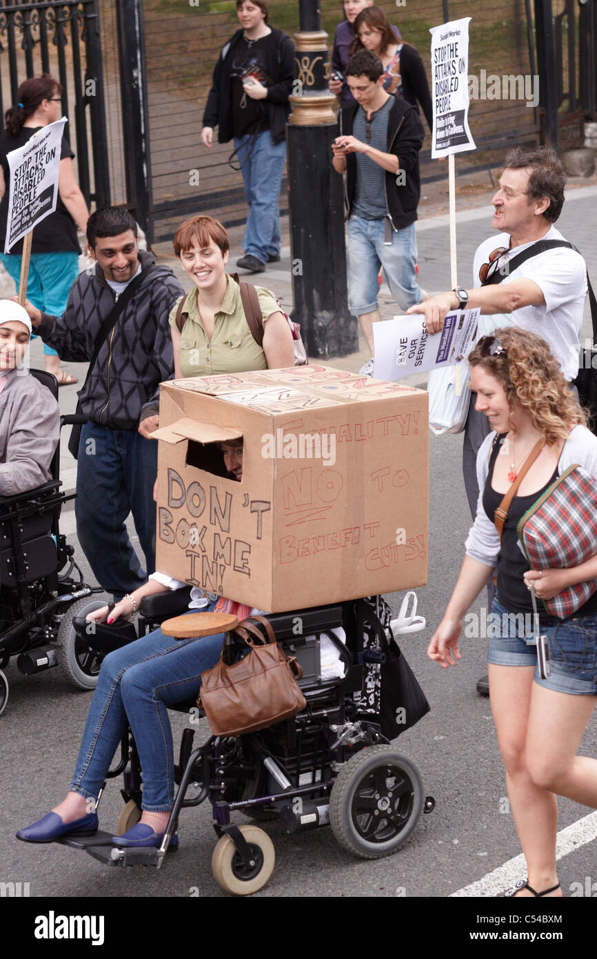 Thousands of disabled people march past Parliament to protest against ...