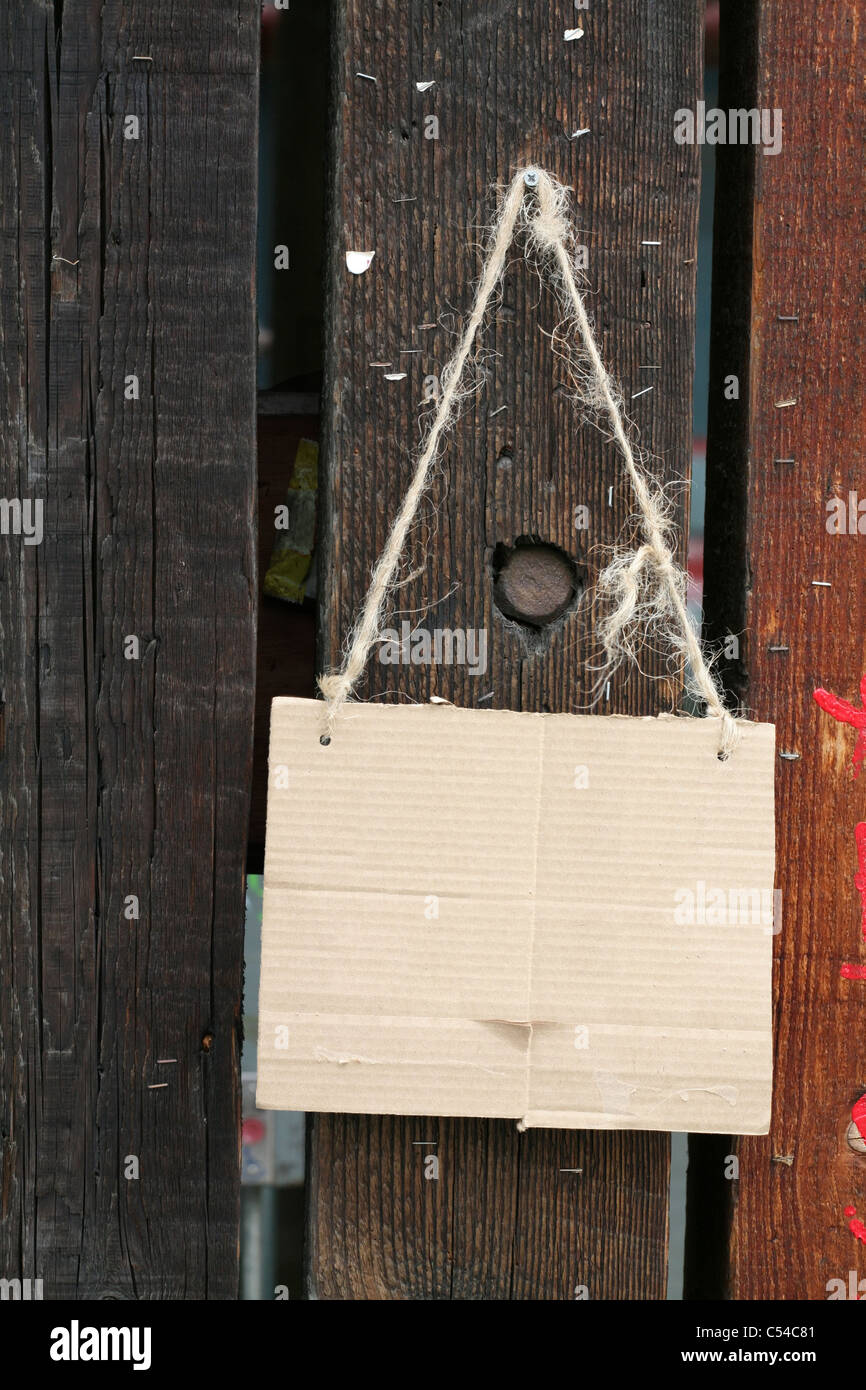 blank cardboard ad sing close up Stock Photo - Alamy