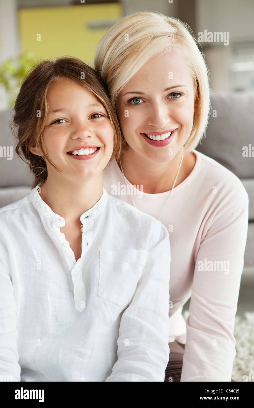 Portrait of a woman smiling with her daughter Stock Photo - Alamy