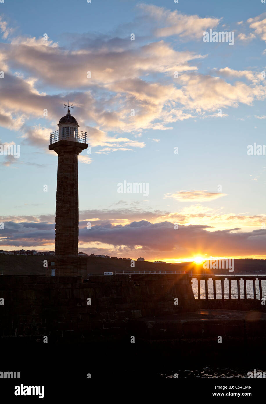 Sunset behind Whitby Lighthouse, North Yorkshire Stock Photo - Alamy