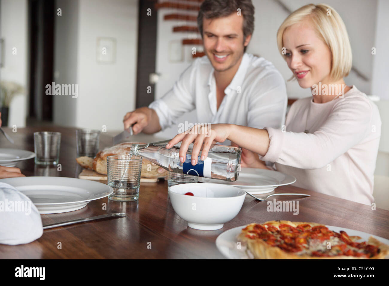 Couple having food Stock Photo - Alamy