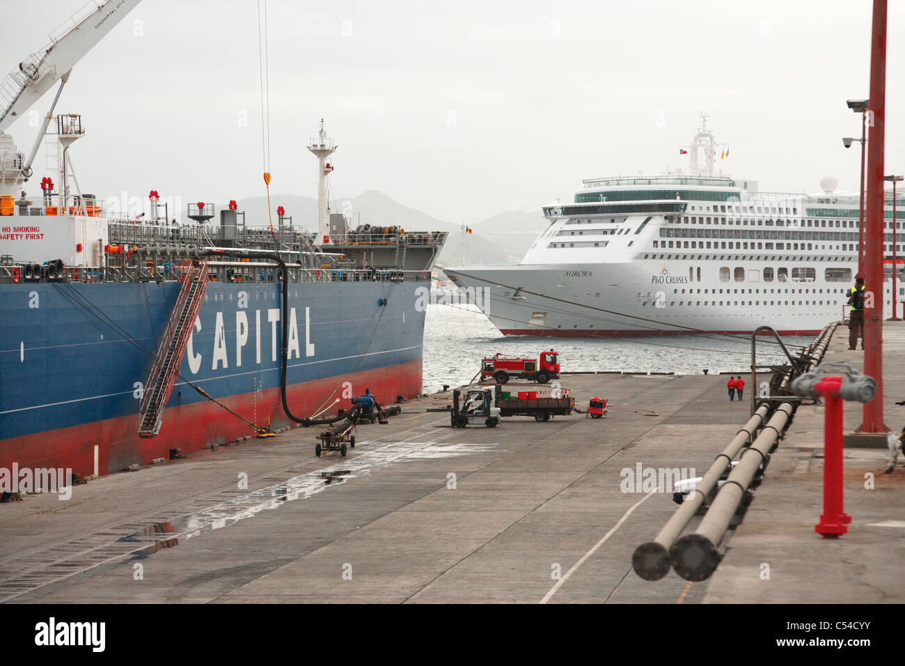Cargo ship and cruise ship facing each other in Ponta Delgada seaport ...