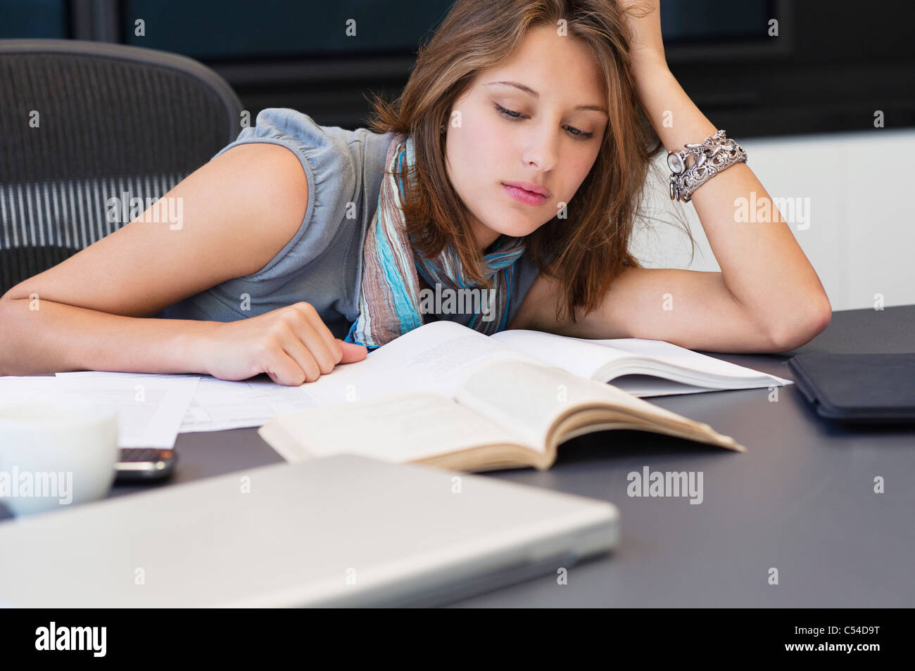 University student looking tired while studying Stock Photo - Alamy