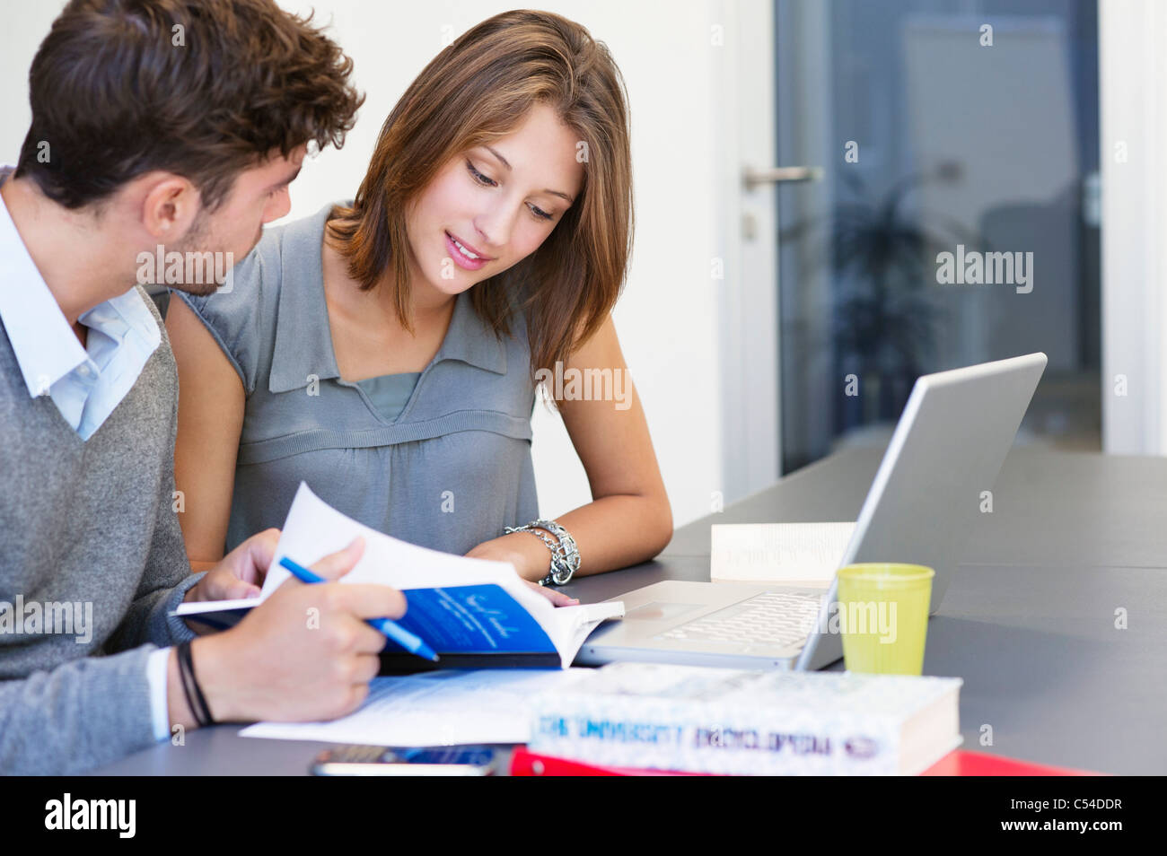 University students using laptop in classroom Stock Photo - Alamy