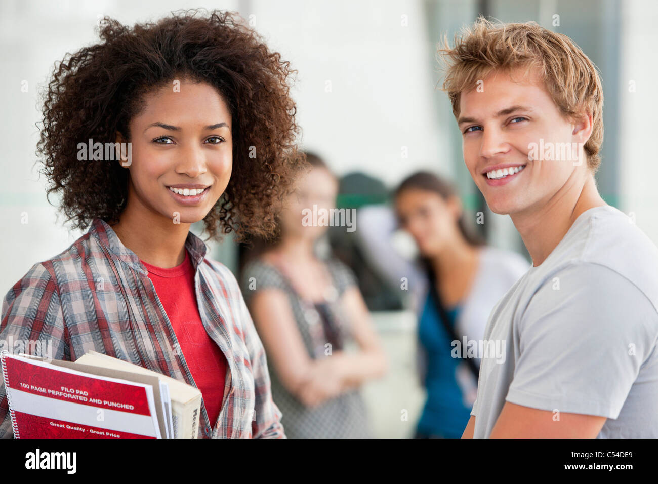 Portrait of two university students smiling Stock Photo - Alamy