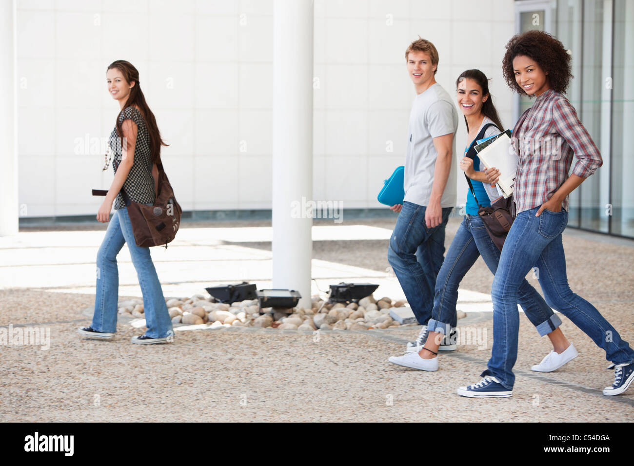 University students walking in a campus Stock Photo - Alamy