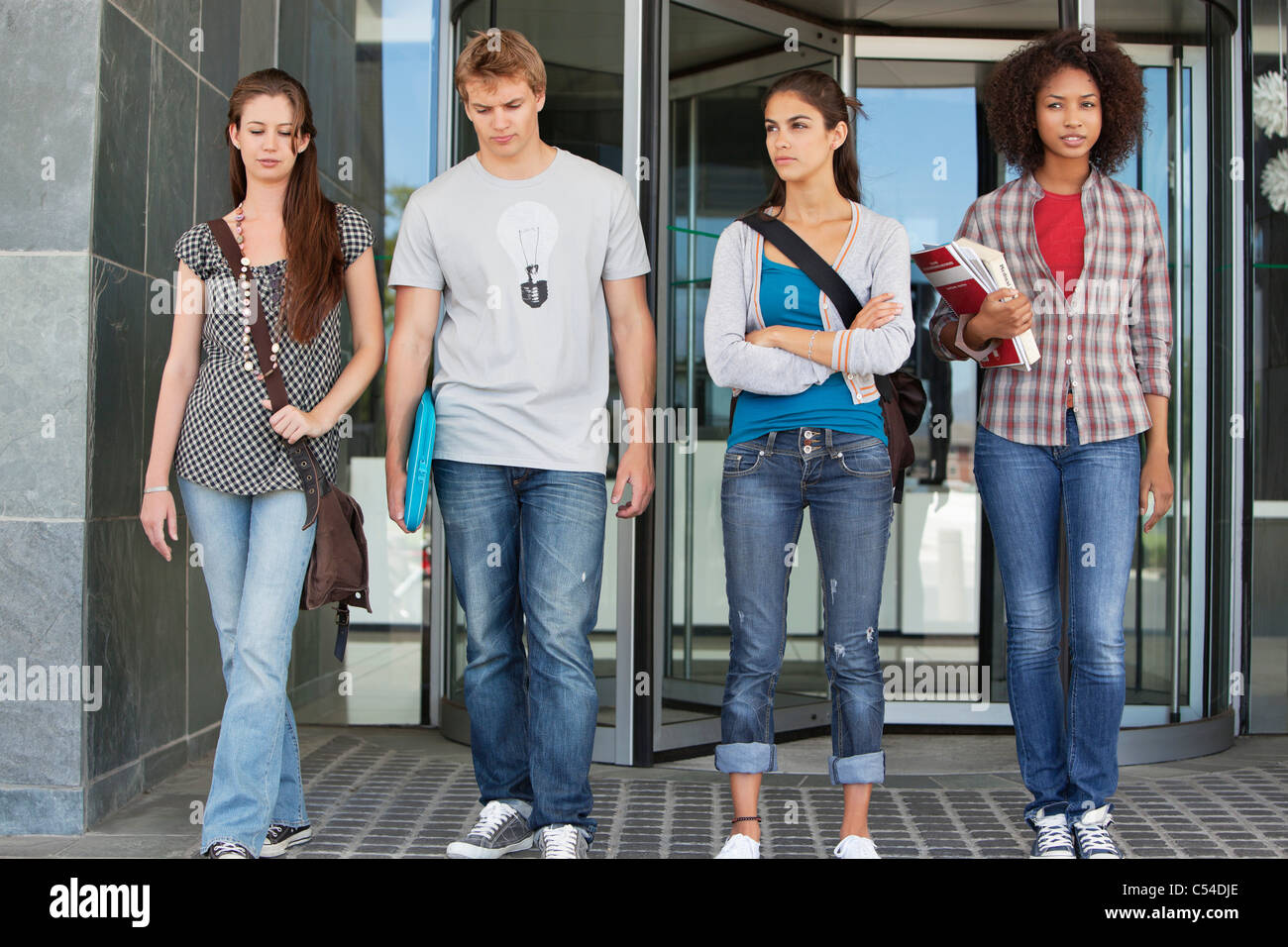 University students standing in campus Stock Photo - Alamy