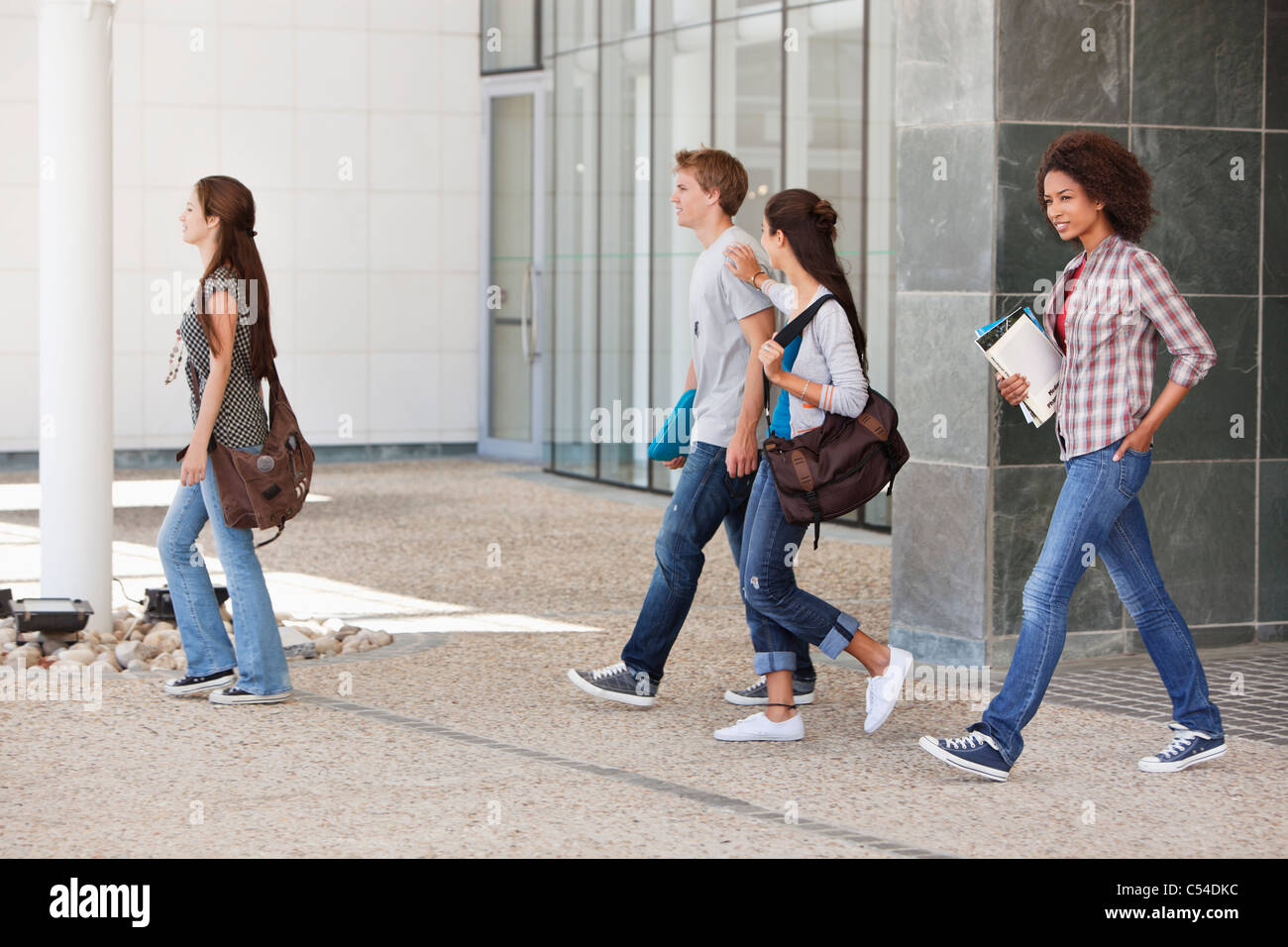 University students walking in a campus Stock Photo - Alamy