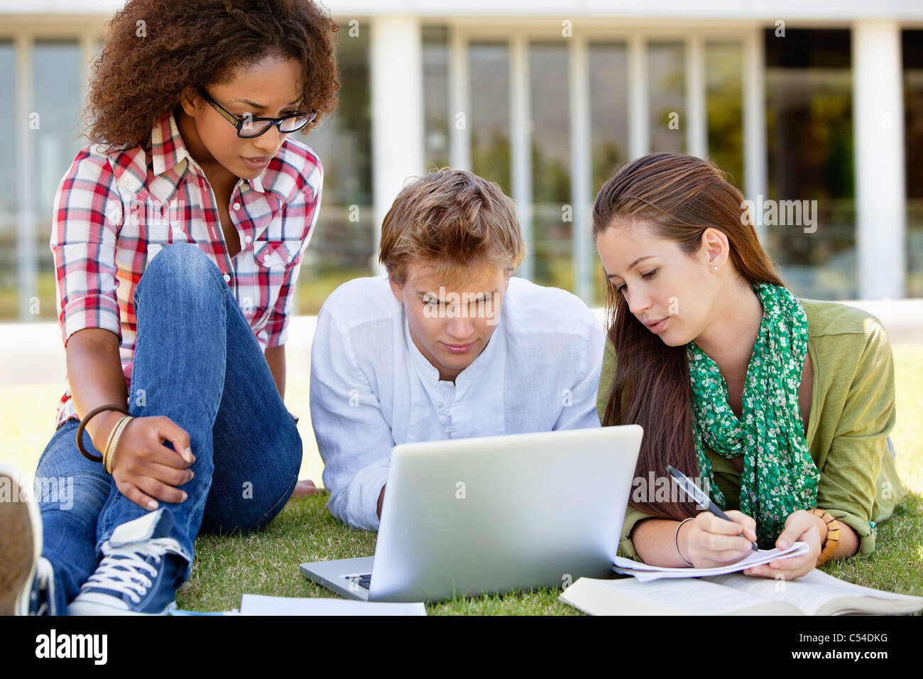 Friends studying in a campus Stock Photo - Alamy
