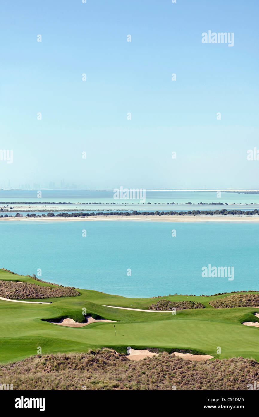Yas Links Golf Course on Yas Island, skyline of Abu Dhabi at the back ...