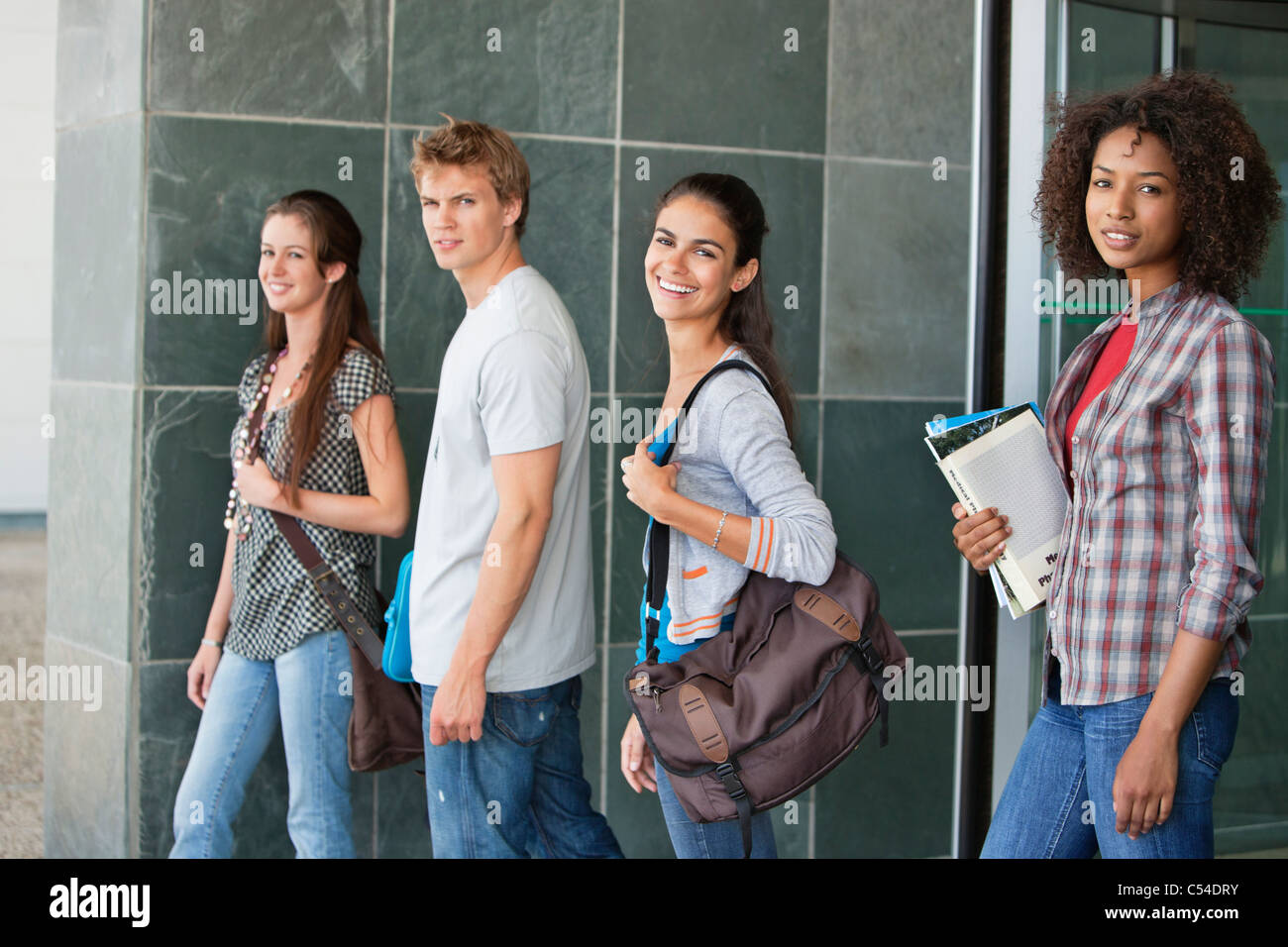 Portrait of university students standing in campus Stock Photo - Alamy