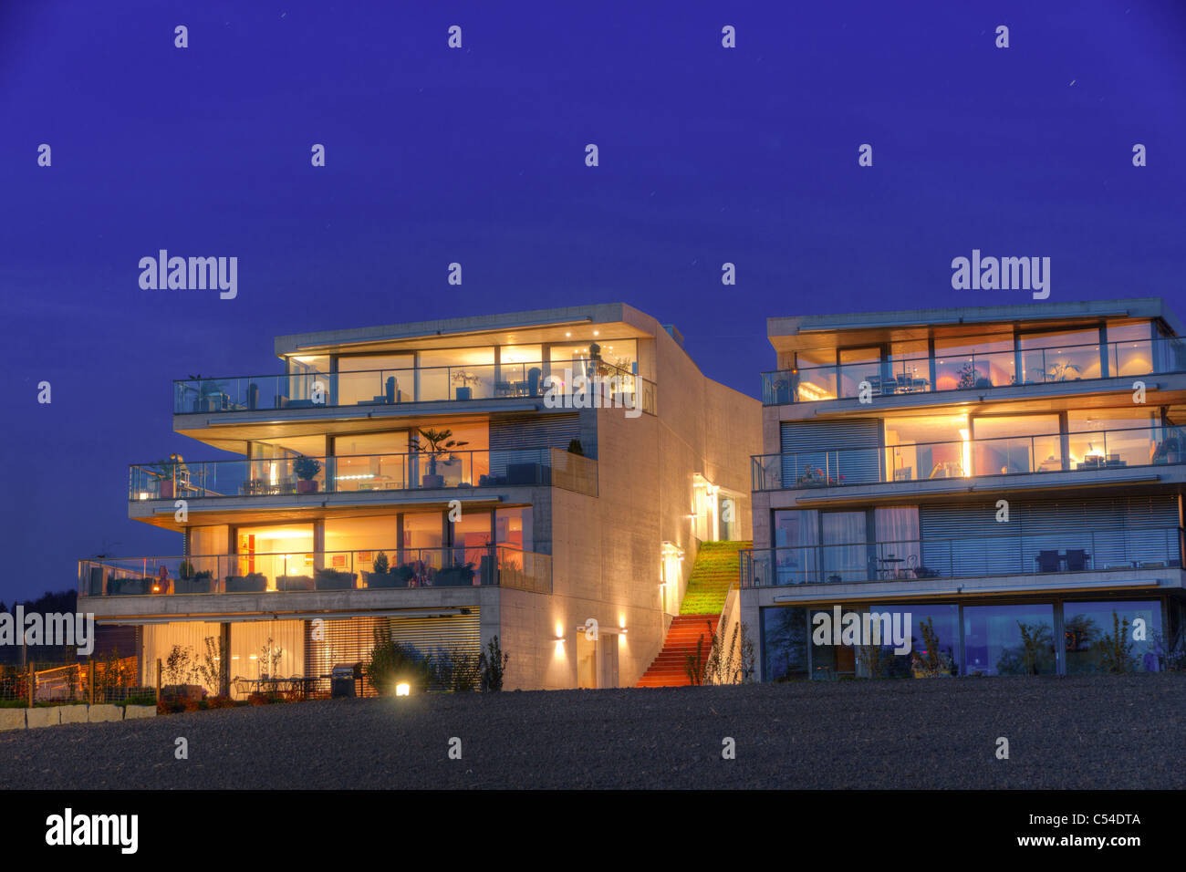 modern comfortable terrace houses illuminated at night Stock Photo - Alamy