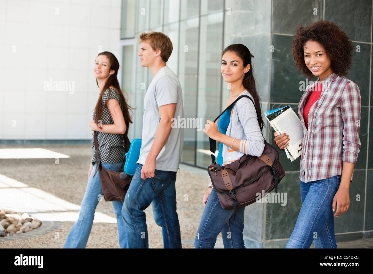 University students walking in a campus Stock Photo - Alamy