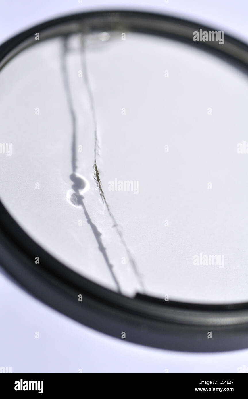 A cracked broken 67mm photographic filter Stock Photo - Alamy