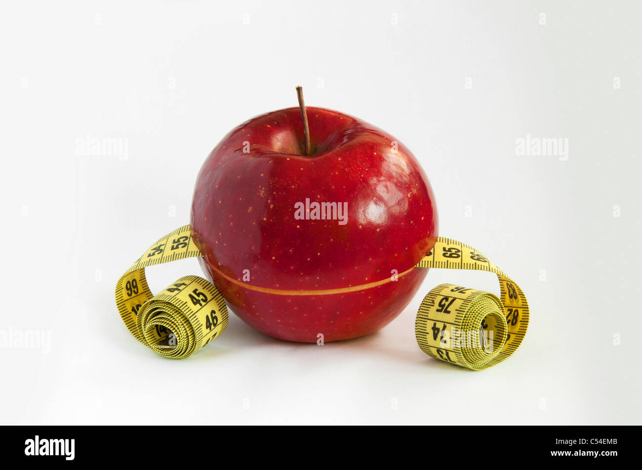 Tape Measure with red Apple isolated on white Stock Photo - Alamy