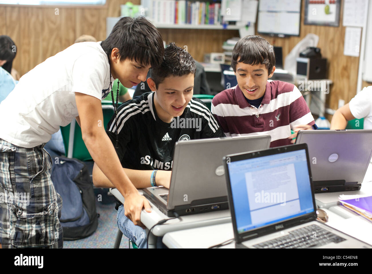 Hispanic classroom students laptop hi-res stock photography and images ...