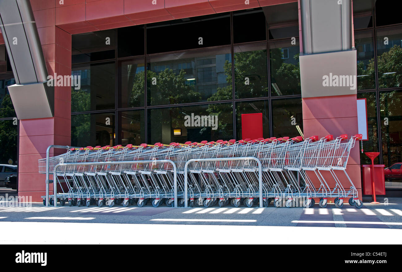 A lot of shopping carts on front of shop Stock Photo - Alamy