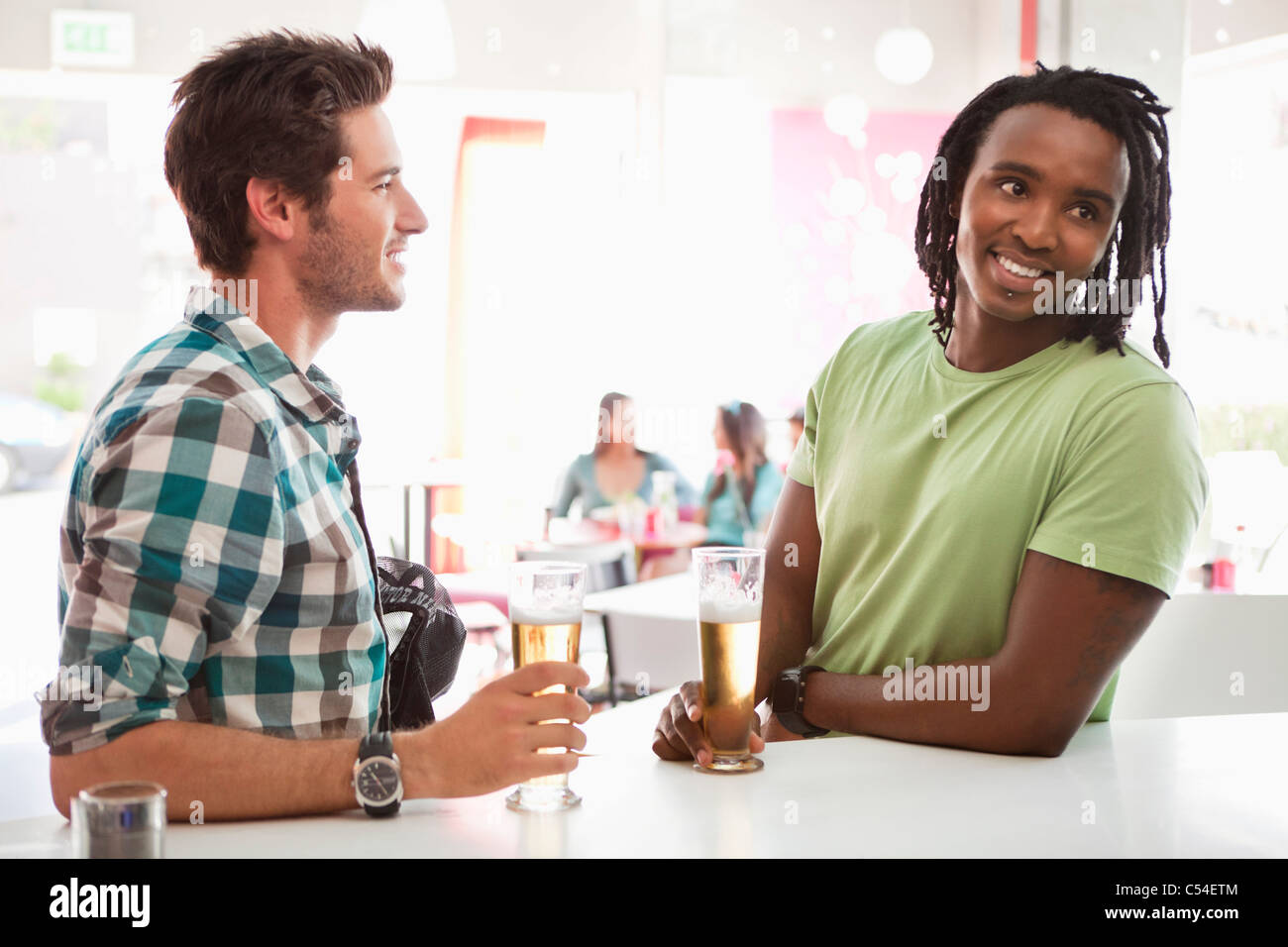 Two friends having a beer in a bar hi-res stock photography and images ...
