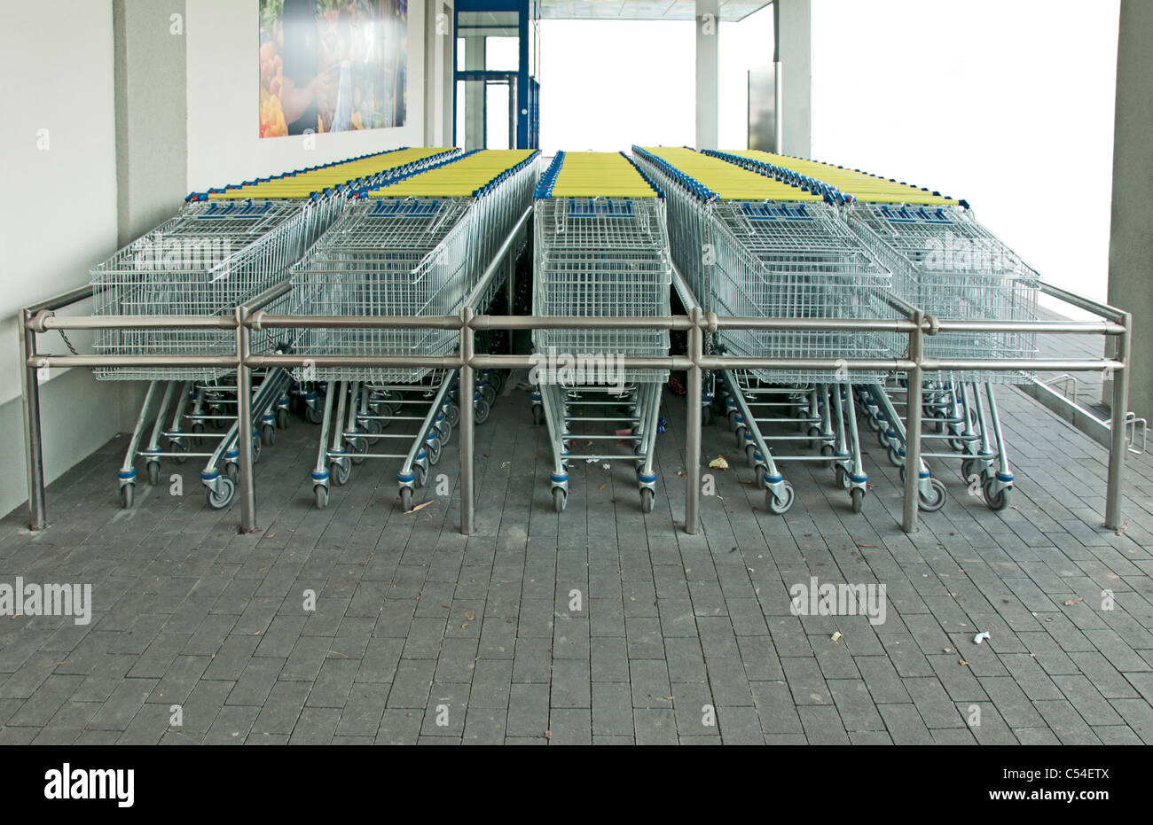 A lot of shopping carts on front of shop Stock Photo - Alamy