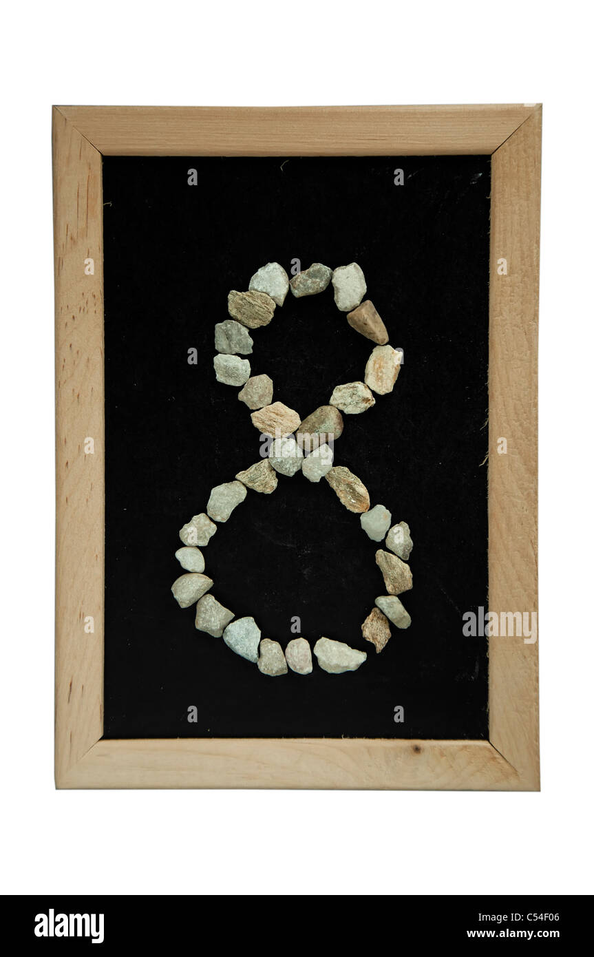 Number eight stone made on black background in frame Stock Photo - Alamy
