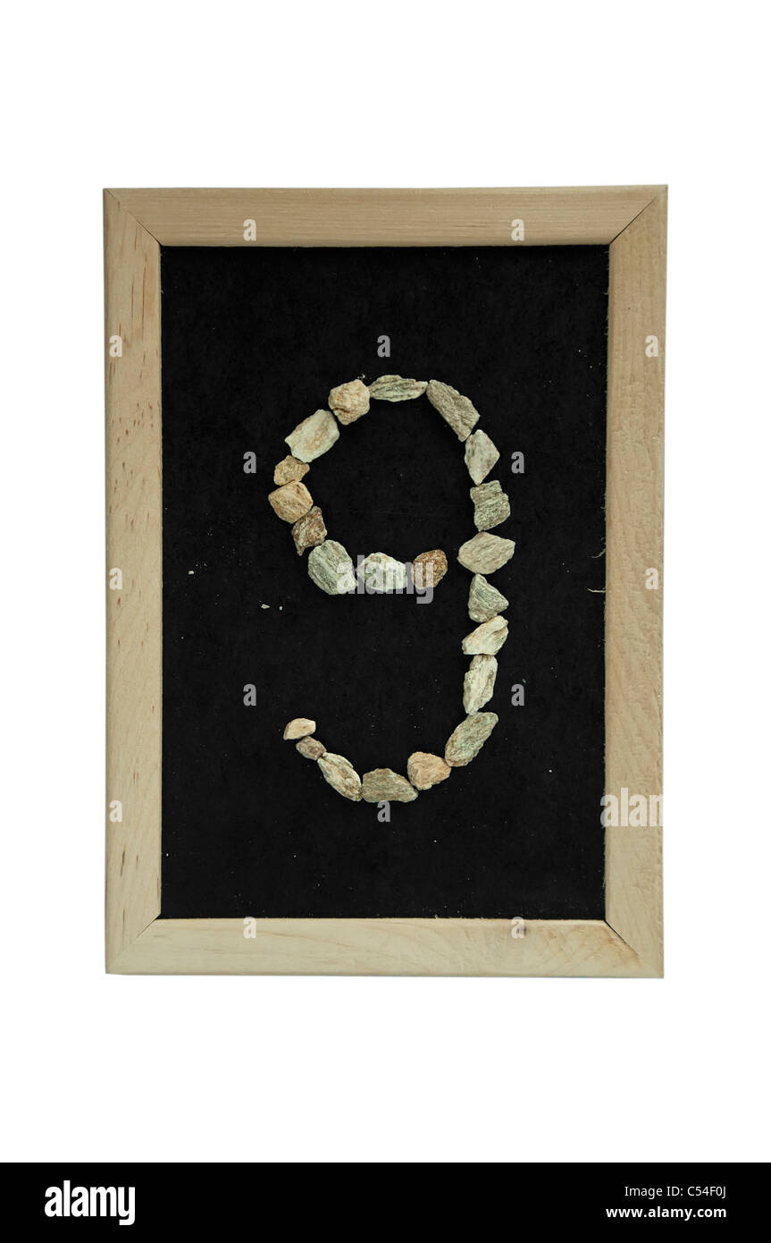 Number nine stone made on black background in frame Stock Photo - Alamy