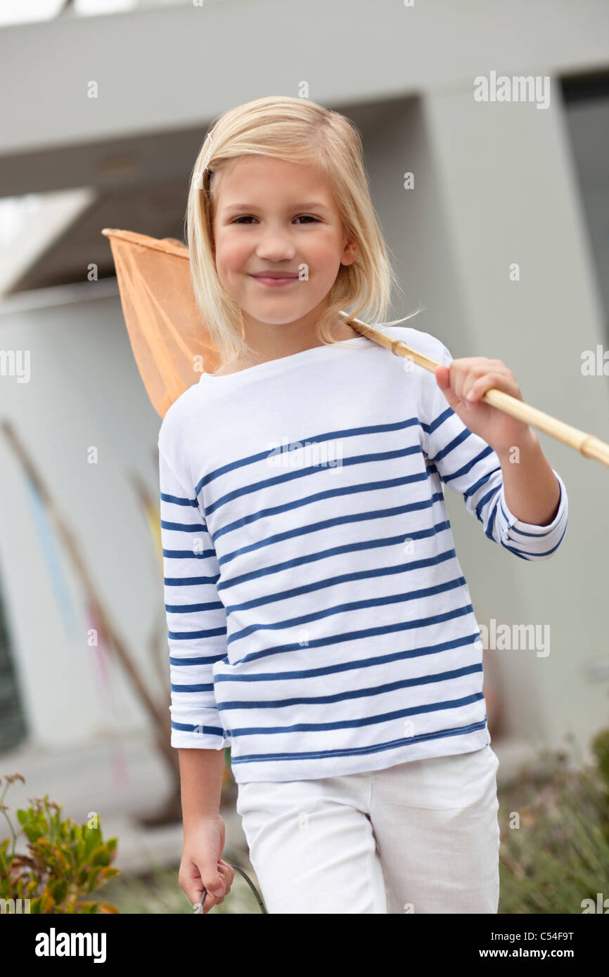 Portrait of a girl carrying net on her shoulder Stock Photo - Alamy