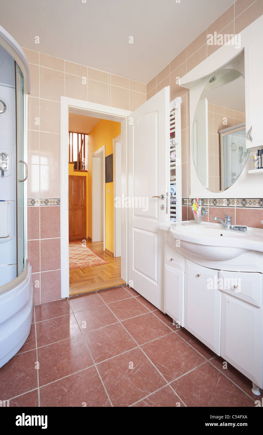Interior of a modern toilet with white furniture and ceramic decorated ...