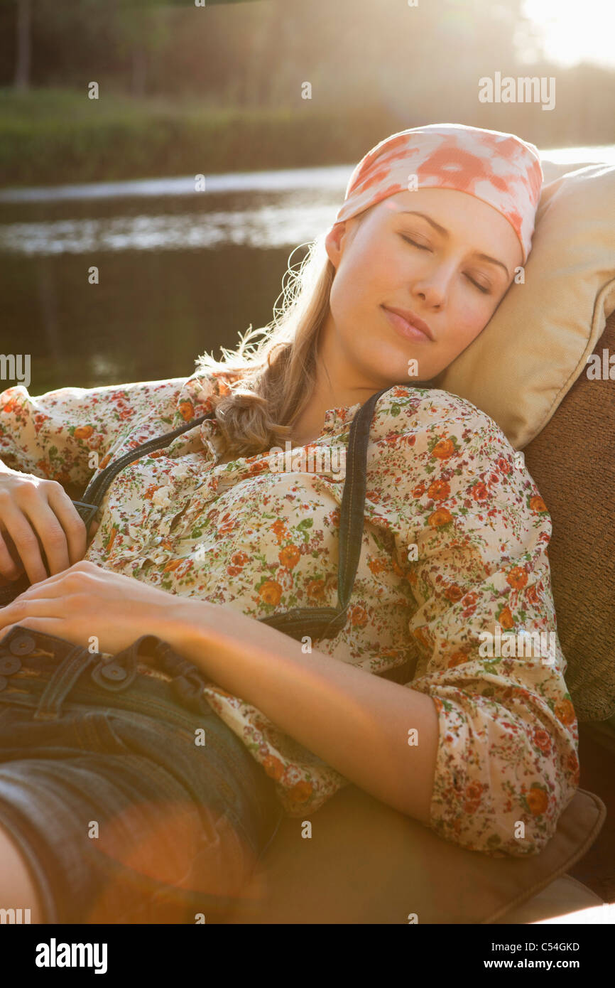 Beautiful woman sleeping in the boat Stock Photo - Alamy