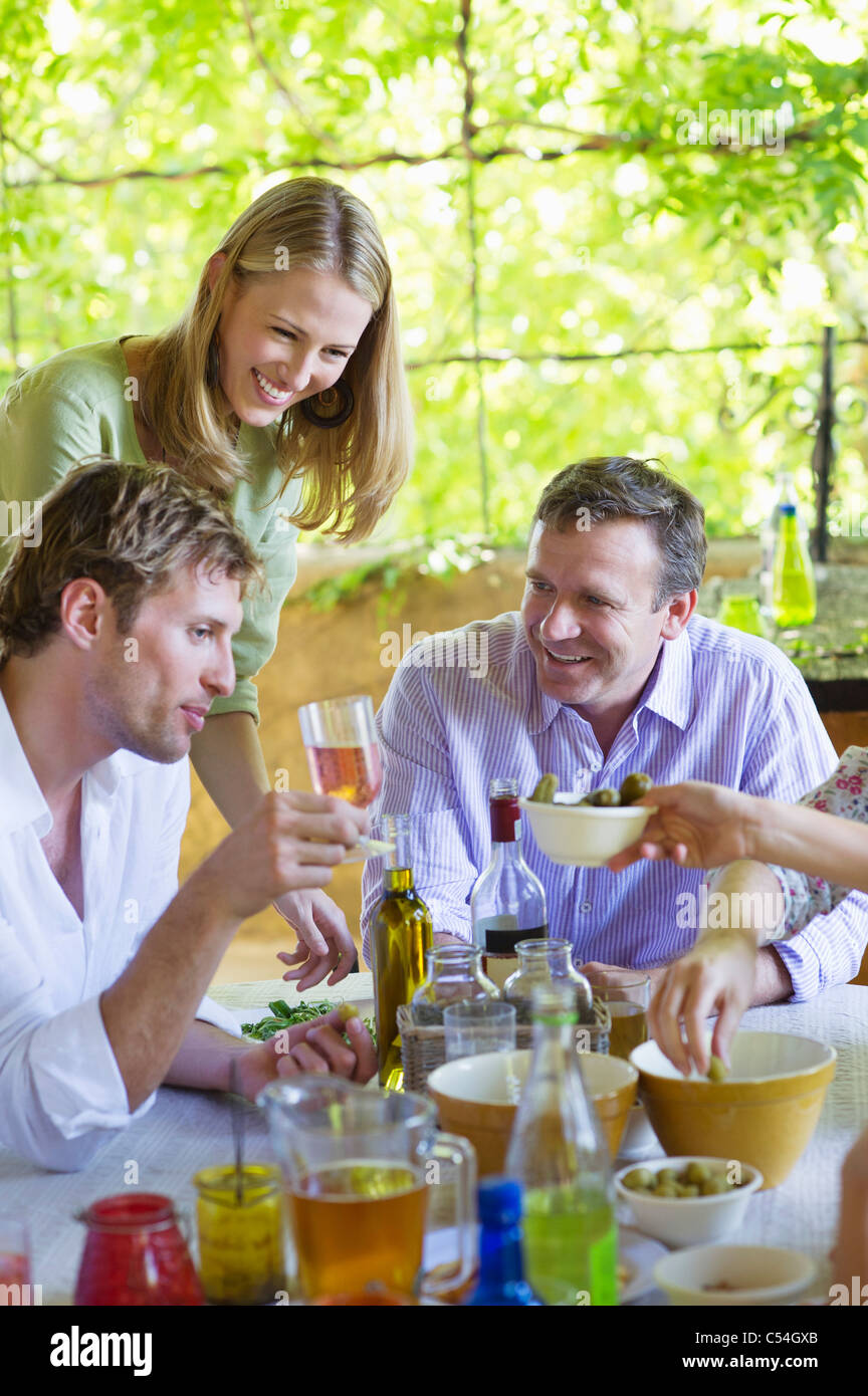 Happy family having drink at home Stock Photo - Alamy