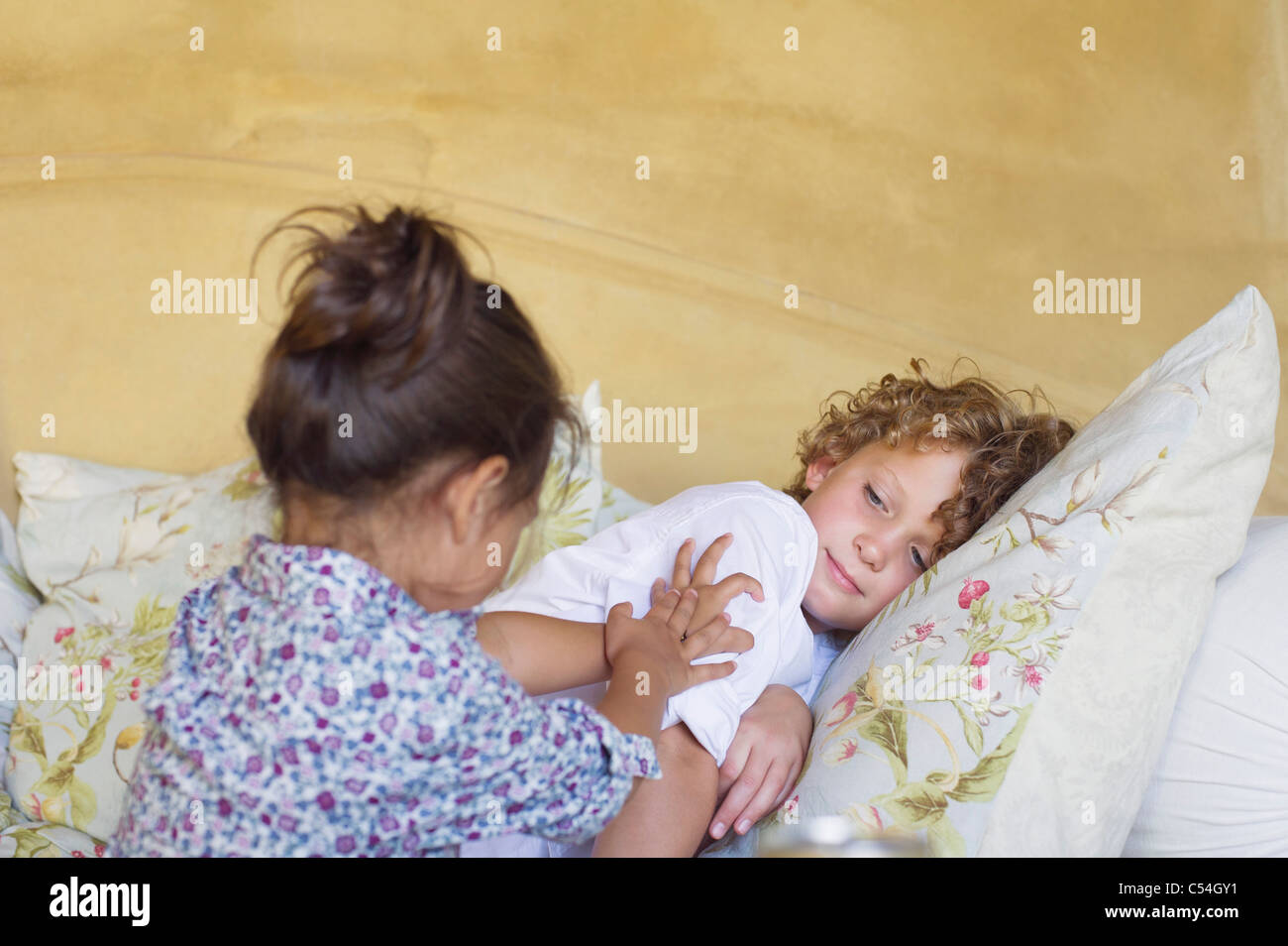 Cute siblings playing together at home Stock Photo - Alamy