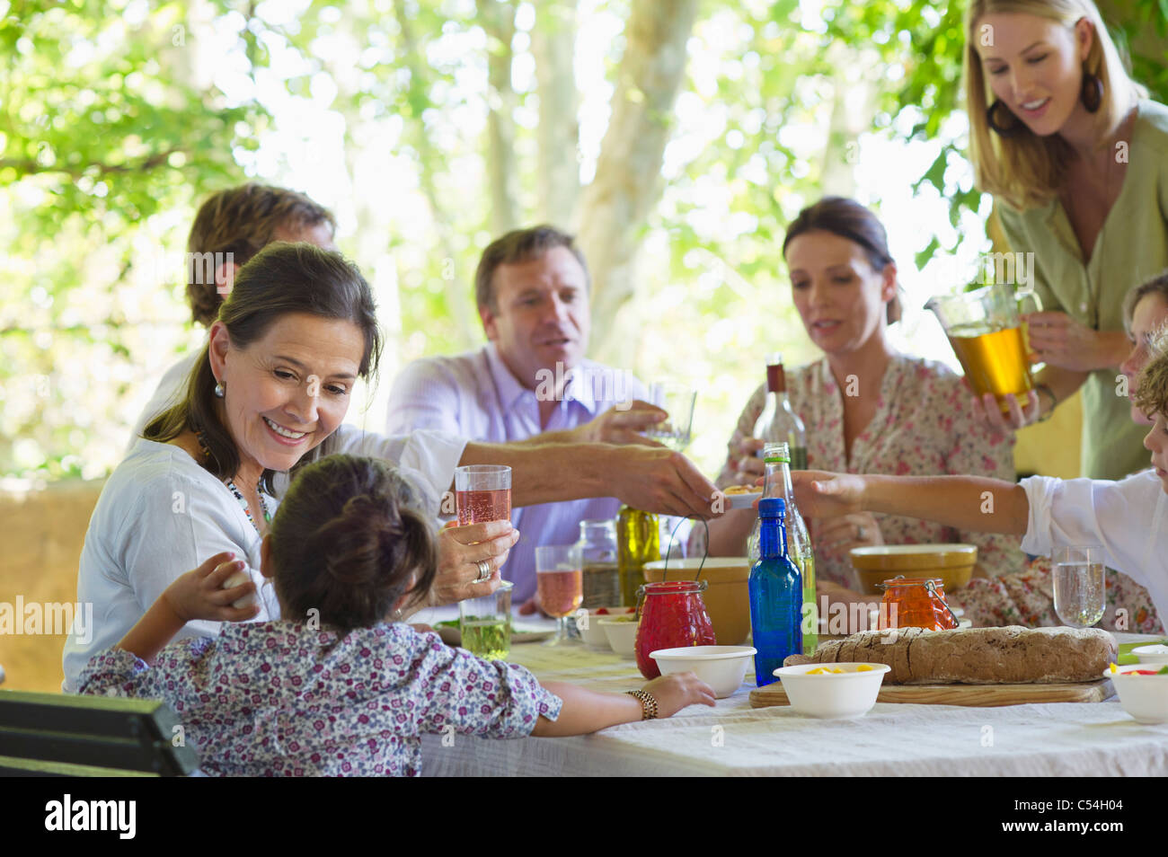 Multi generation family eating food at house Stock Photo - Alamy