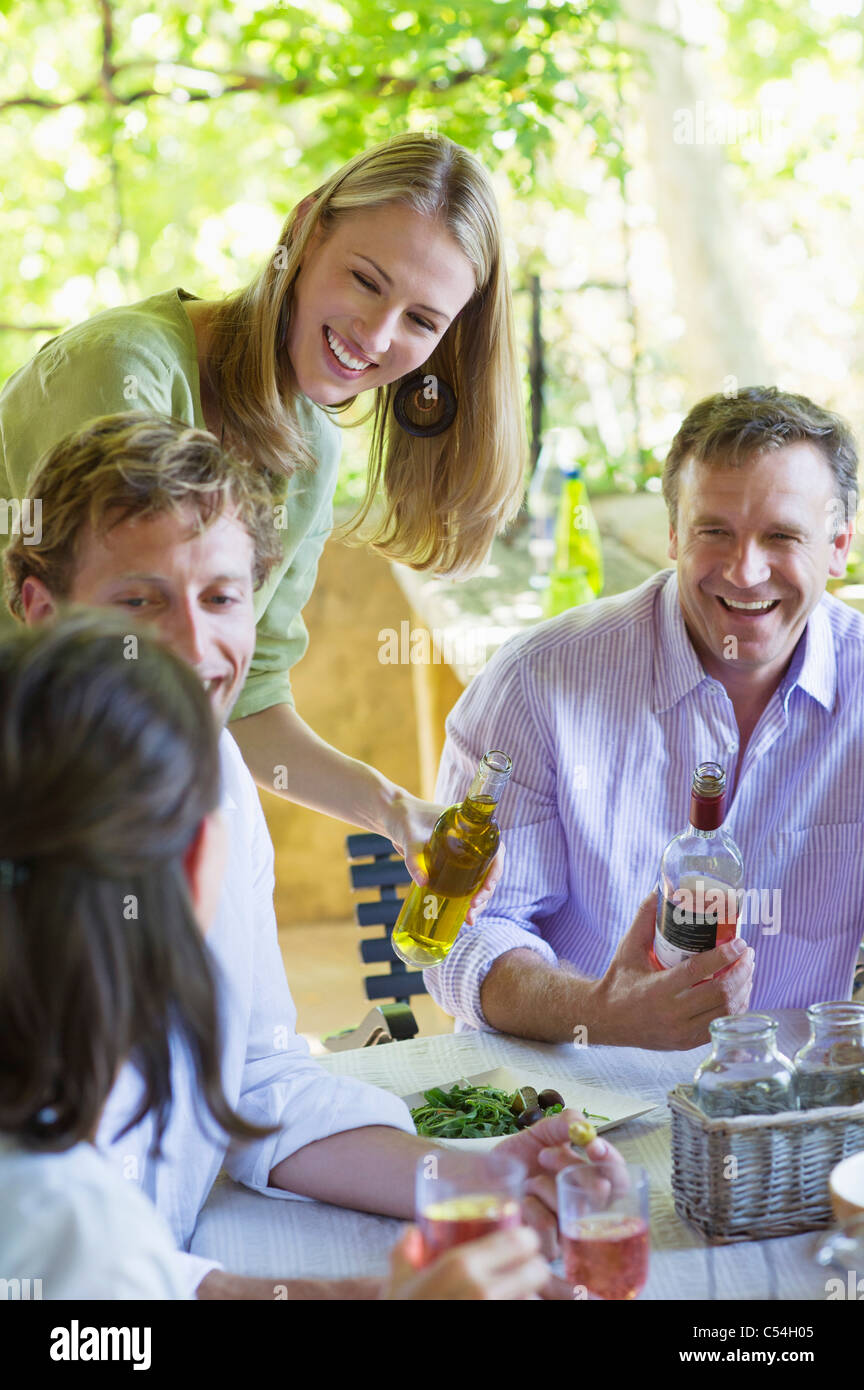Happy family having drink at home Stock Photo - Alamy