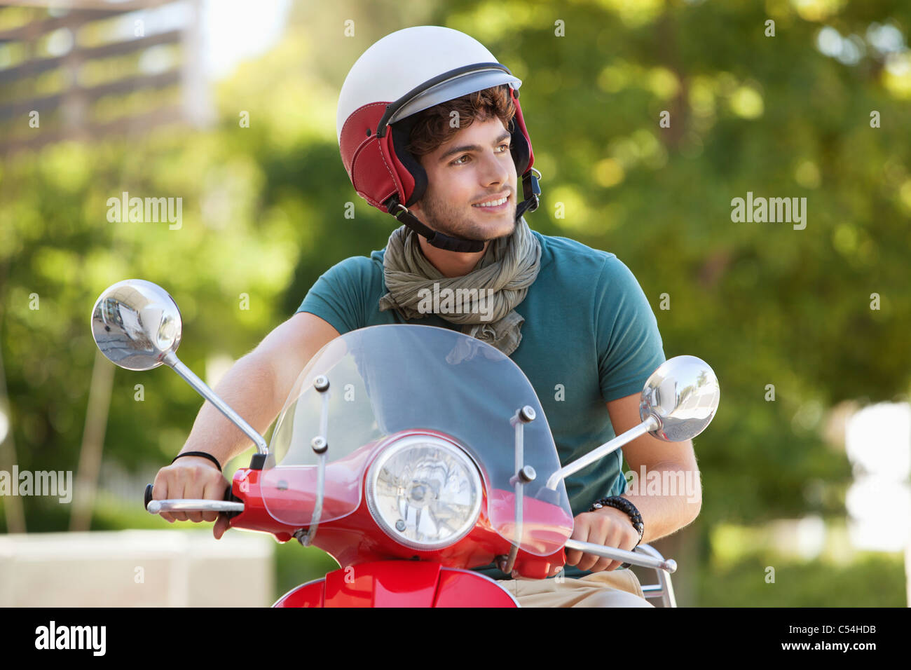 Man riding a scooter Stock Photo - Alamy