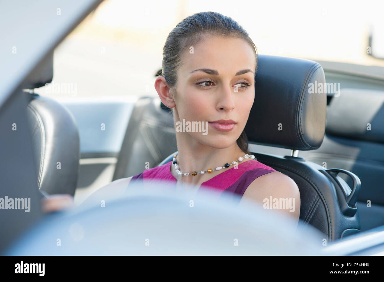 Young woman driving a convertible car Stock Photo - Alamy