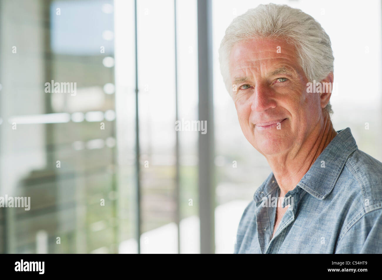 Portrait of a senior man smiling Stock Photo - Alamy